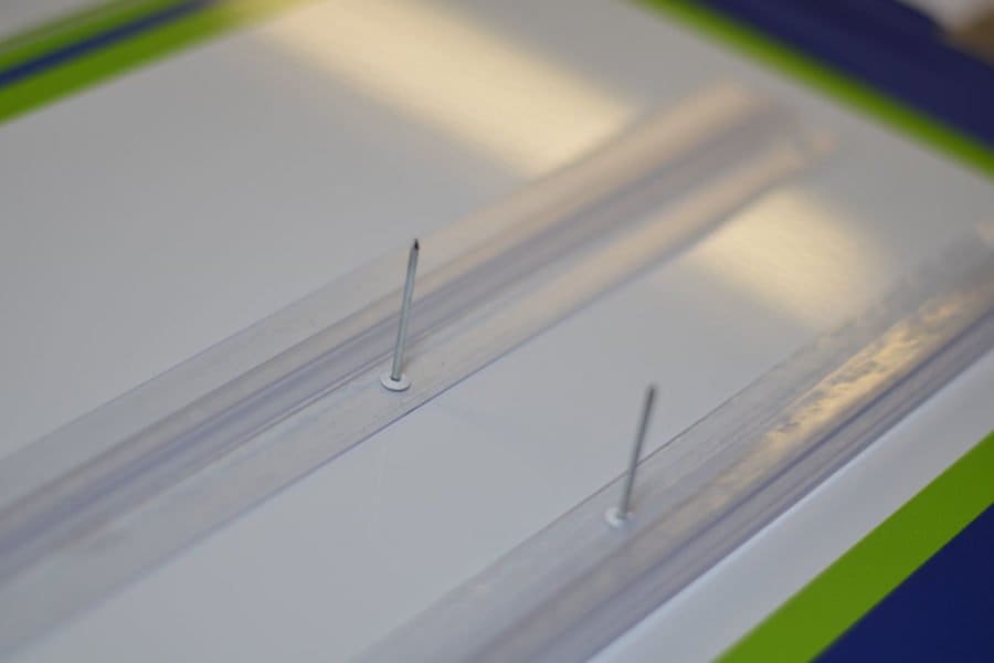 close up of white rivets awaiting installation - READERBOARDS